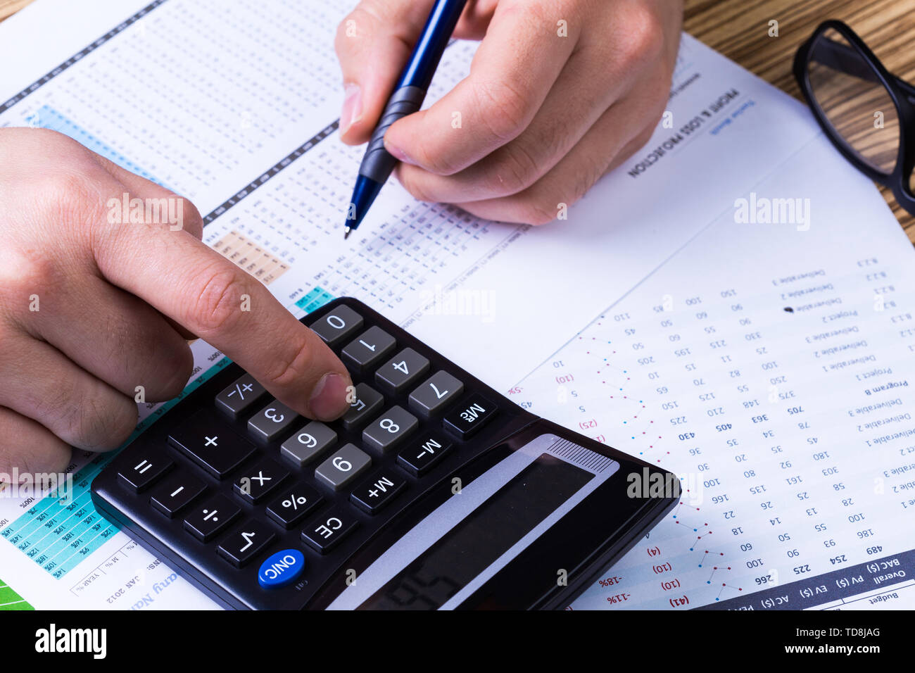 Graphs and Calculator Stock Photo - Alamy