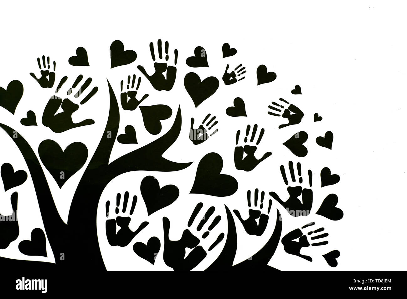 Tree whose leaves are depicted in the form of palms and hearts. The ...