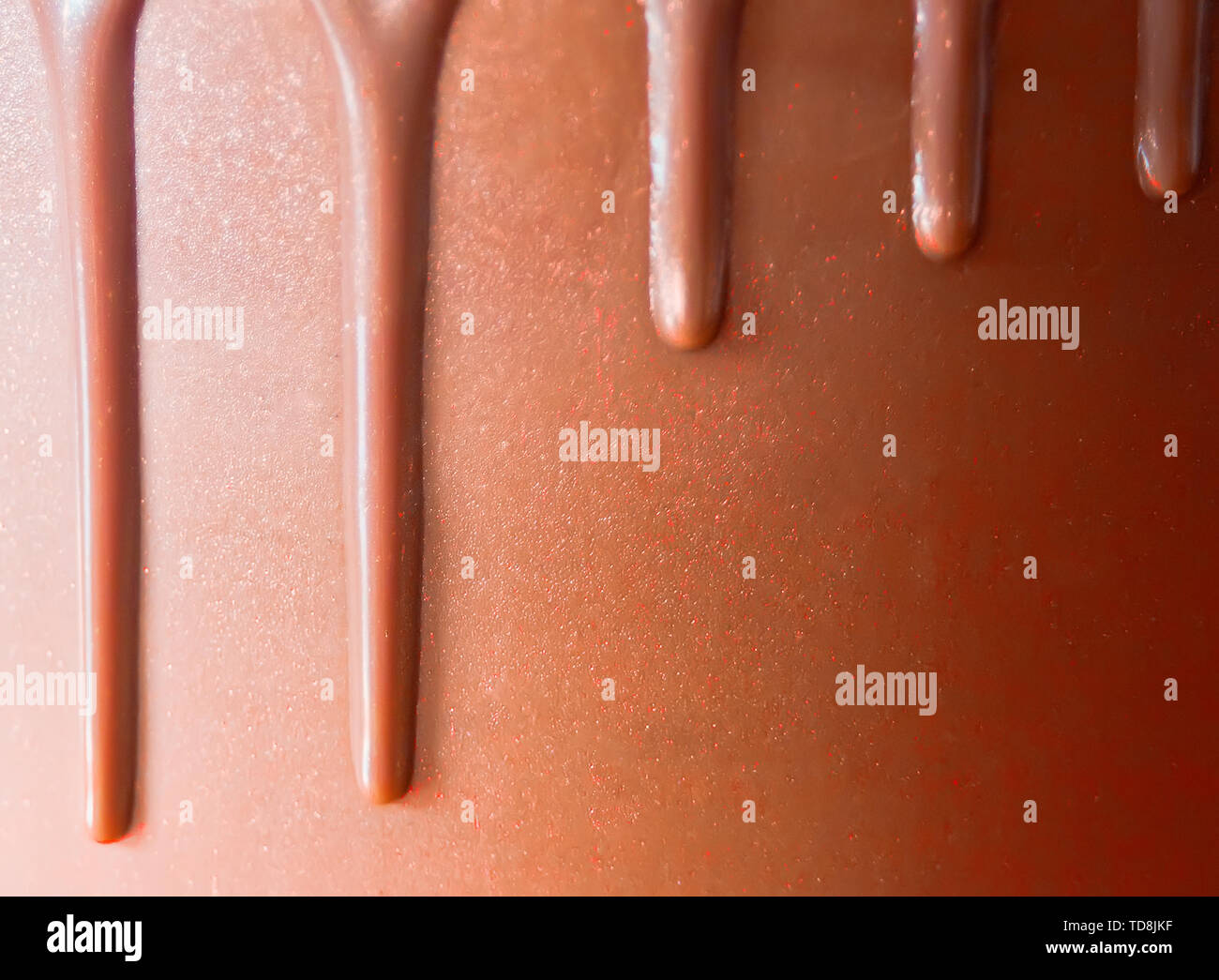 Melted chocolate is dripping. Streams on the cake. Close up of ...