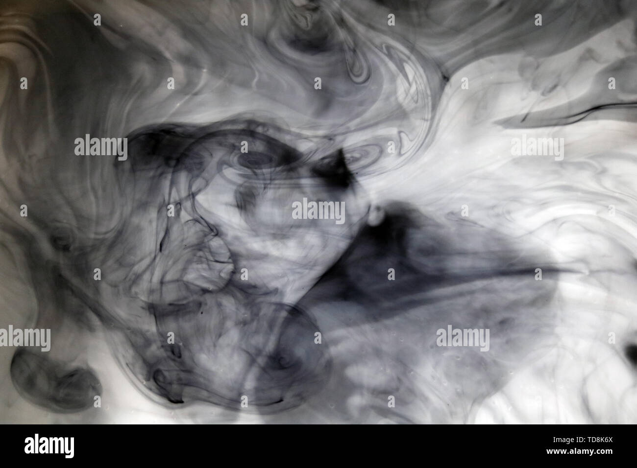 Ink background, ink flowing in water Stock Photo - Alamy