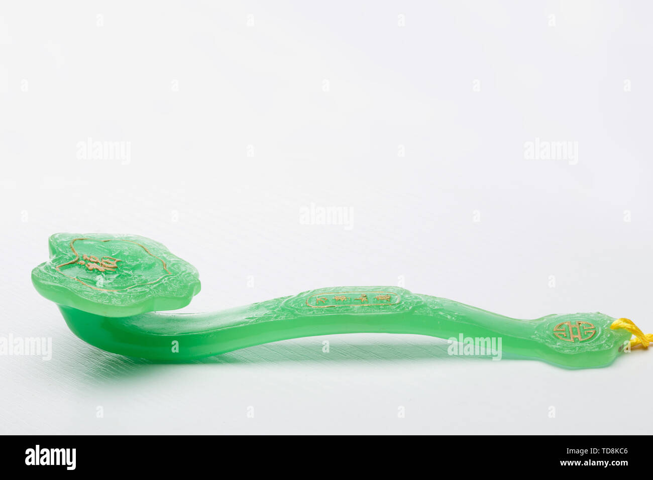 Jade ruyi on white background Stock Photo - Alamy
