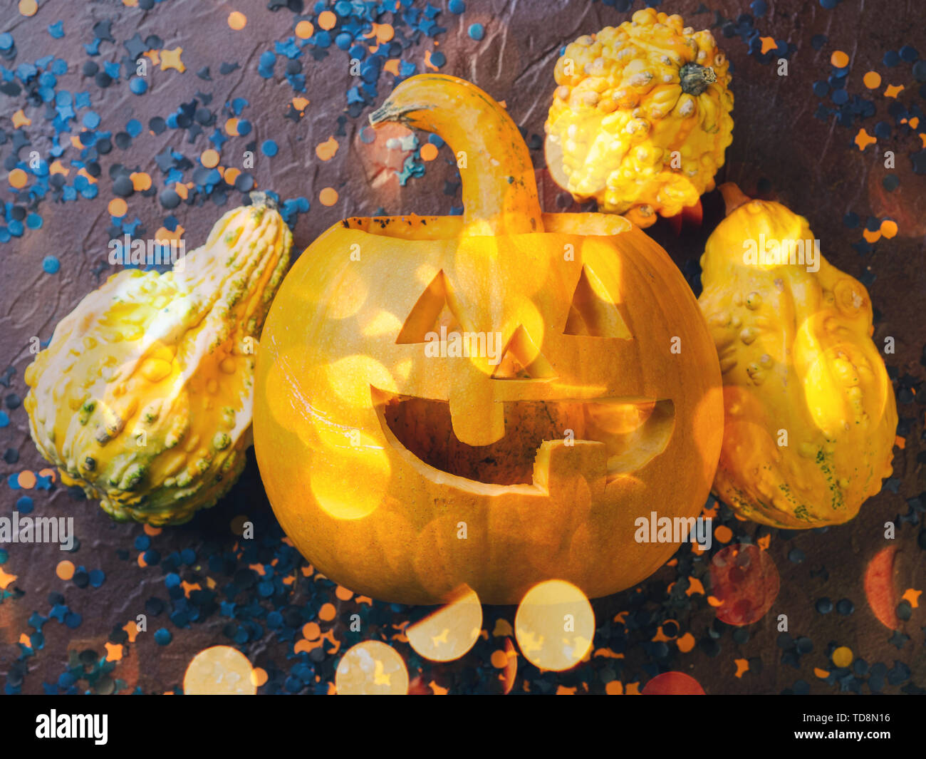 Halloween carved squash and confetti. Dark Holiday spooky background ...