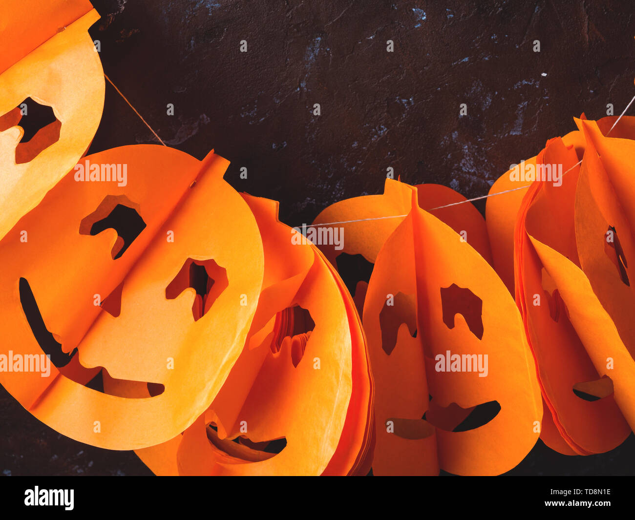 Halloween carved squash banner on dark brown wall Stock Photo - Alamy