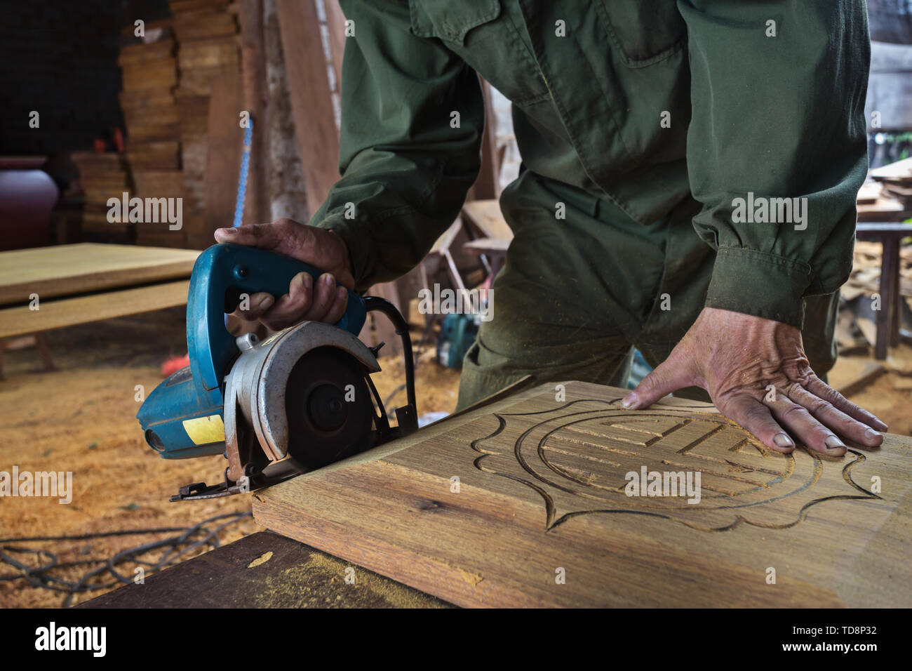 Man cutting wood by machine Stock Photo - Alamy