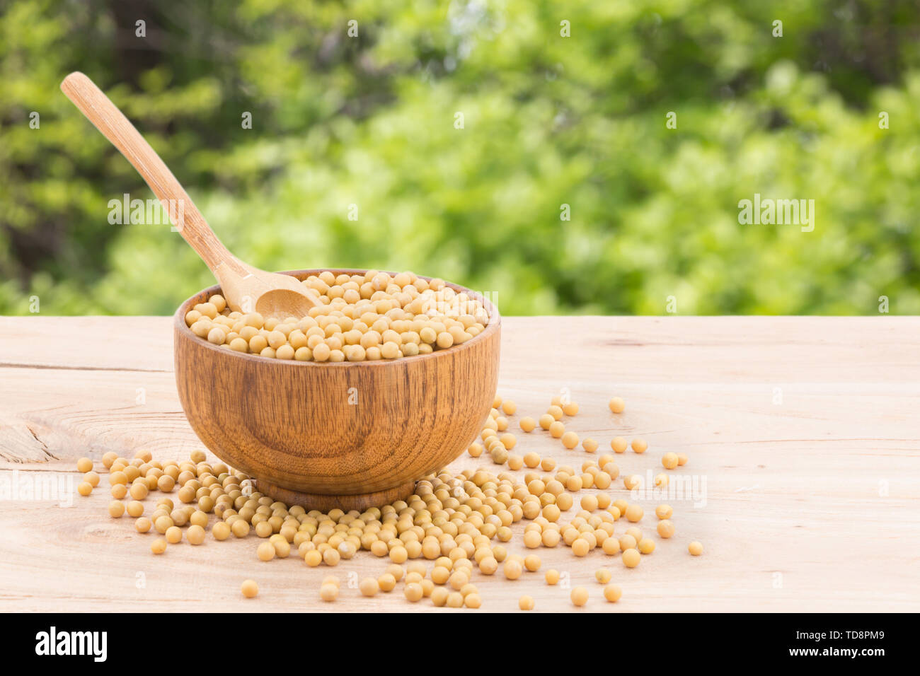Soybeans on wooden board background Stock Photo - Alamy