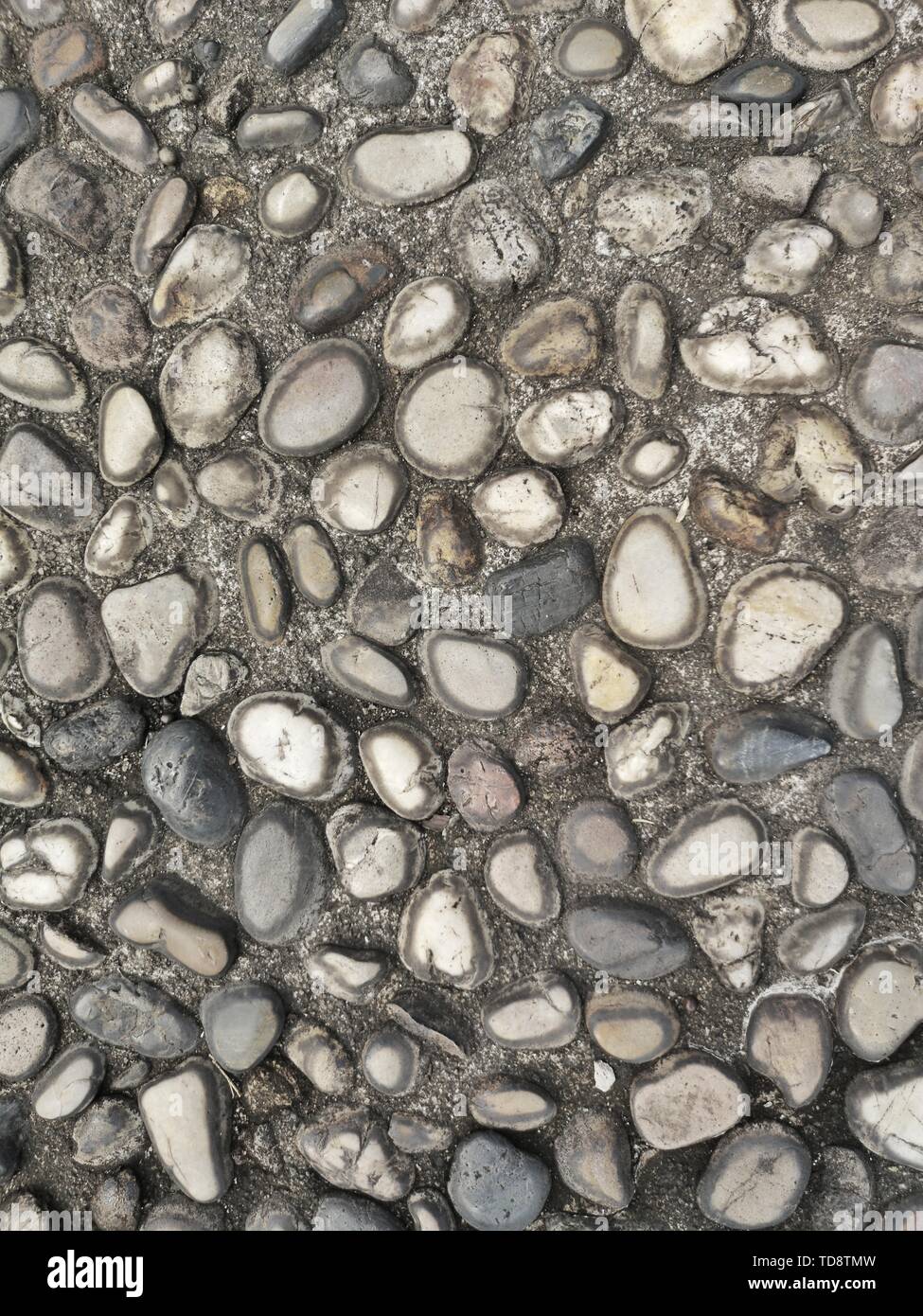 Gray cobblestone ground background Stock Photo - Alamy