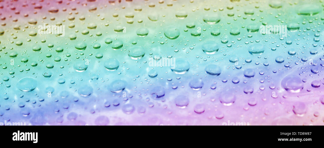 Rainbow water drops surface. Abstract summer background Stock Photo - Alamy