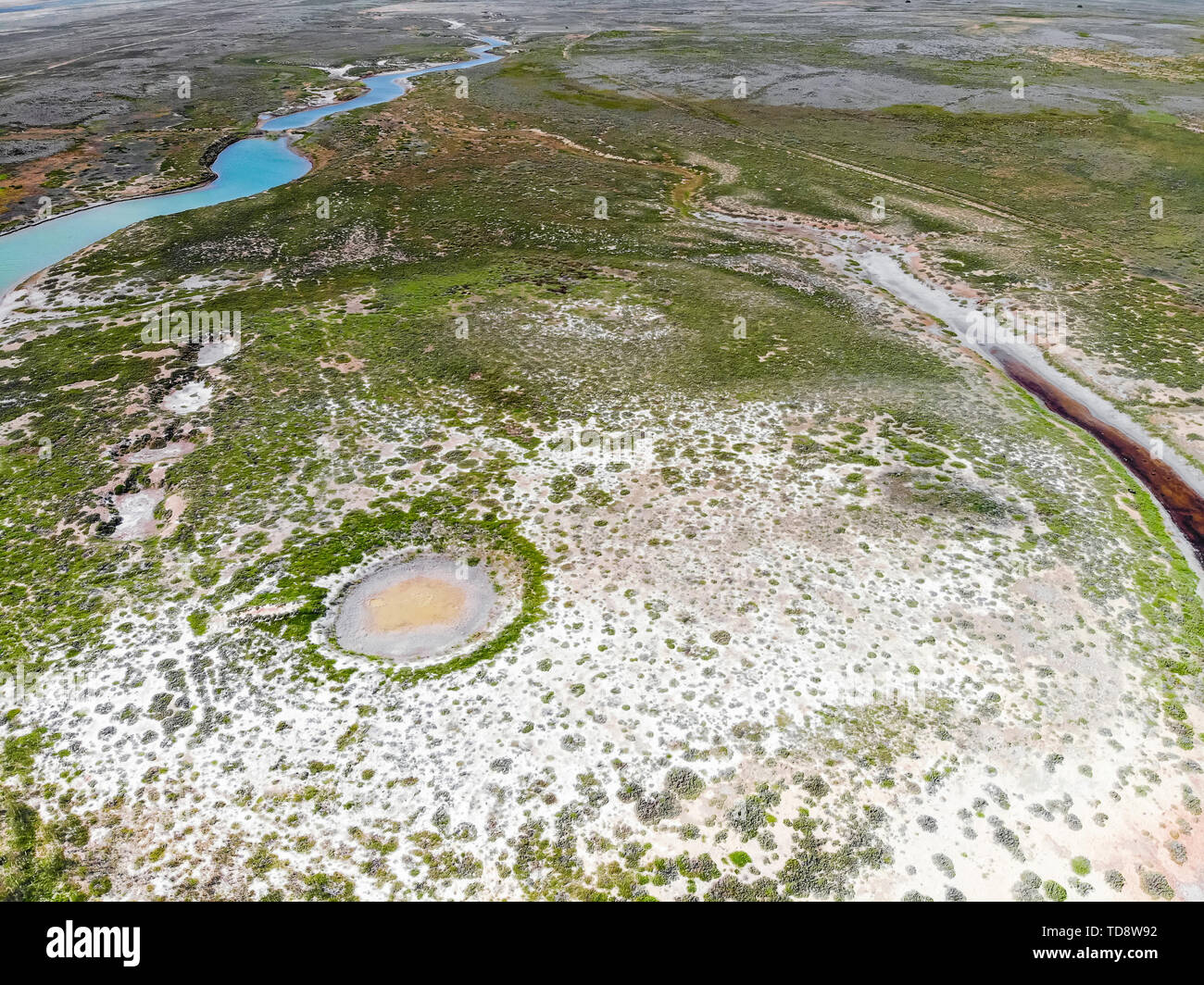 Amazing aerial view of small red water river and green water lake Stock ...