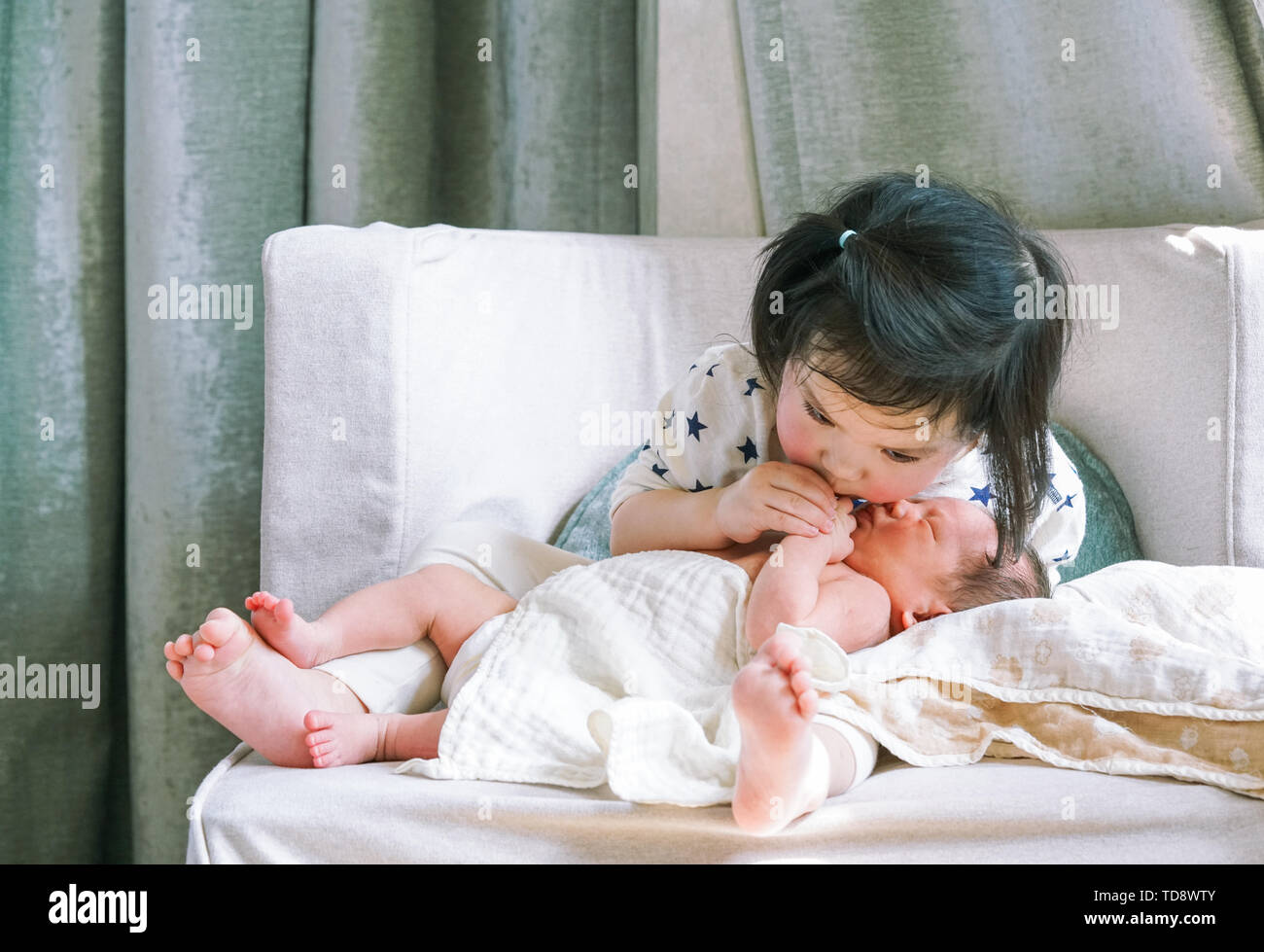 Second child family hi-res stock photography and images - Alamy
