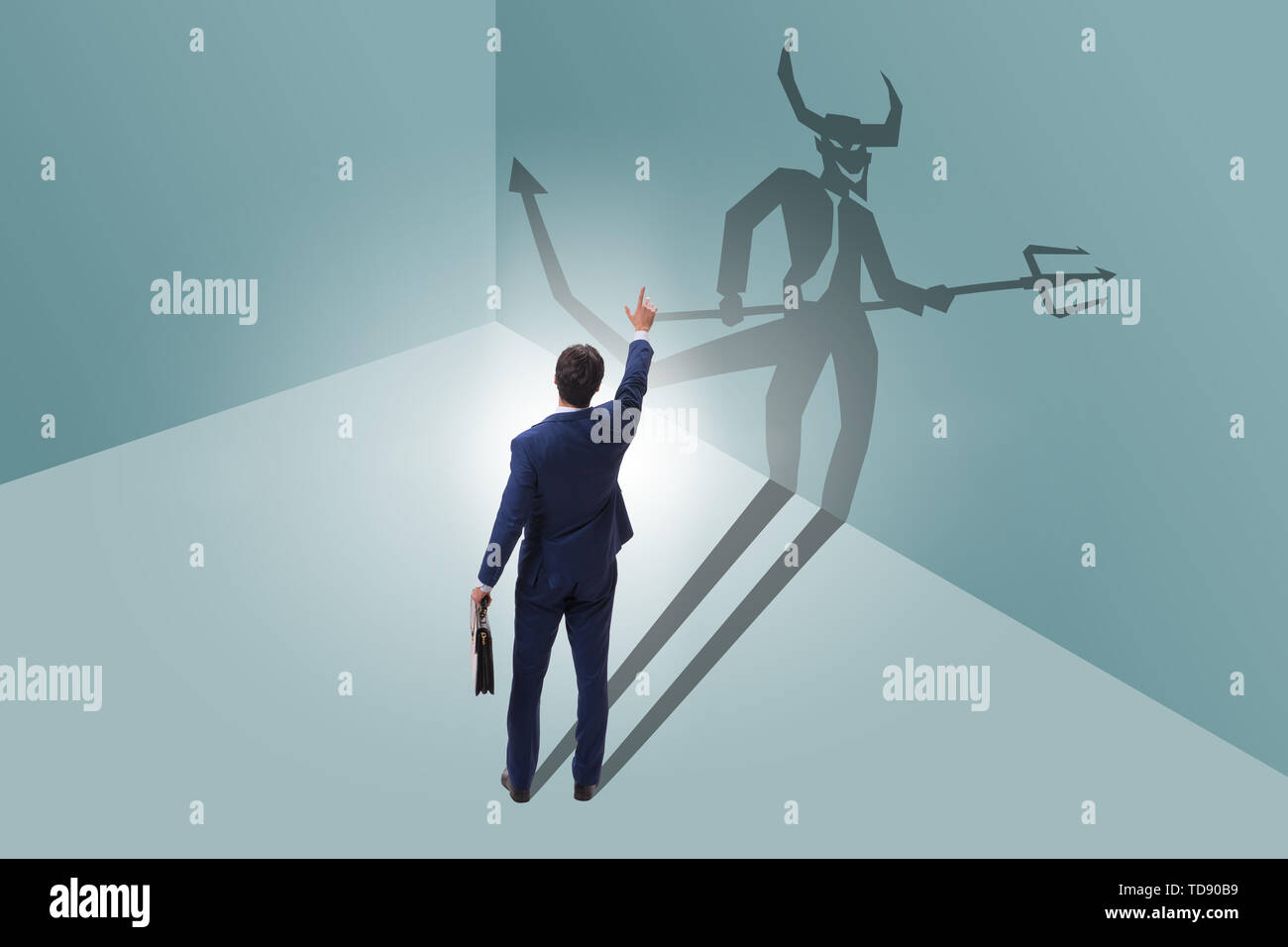 Devil hiding in the businessman - alter ego concept Stock Photo - Alamy