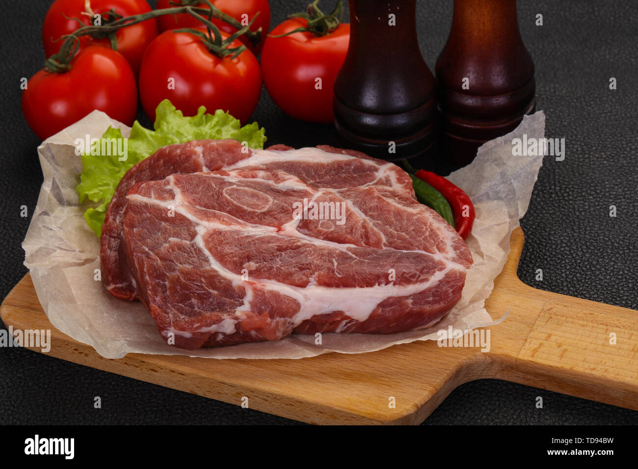 Raw pork neck steak ready for cooking Stock Photo - Alamy