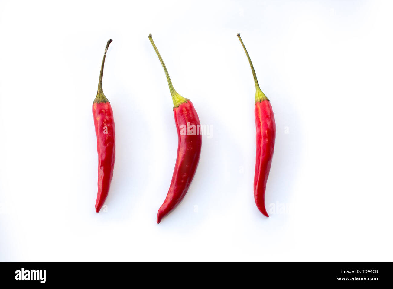three red chilies Stock Photo - Alamy