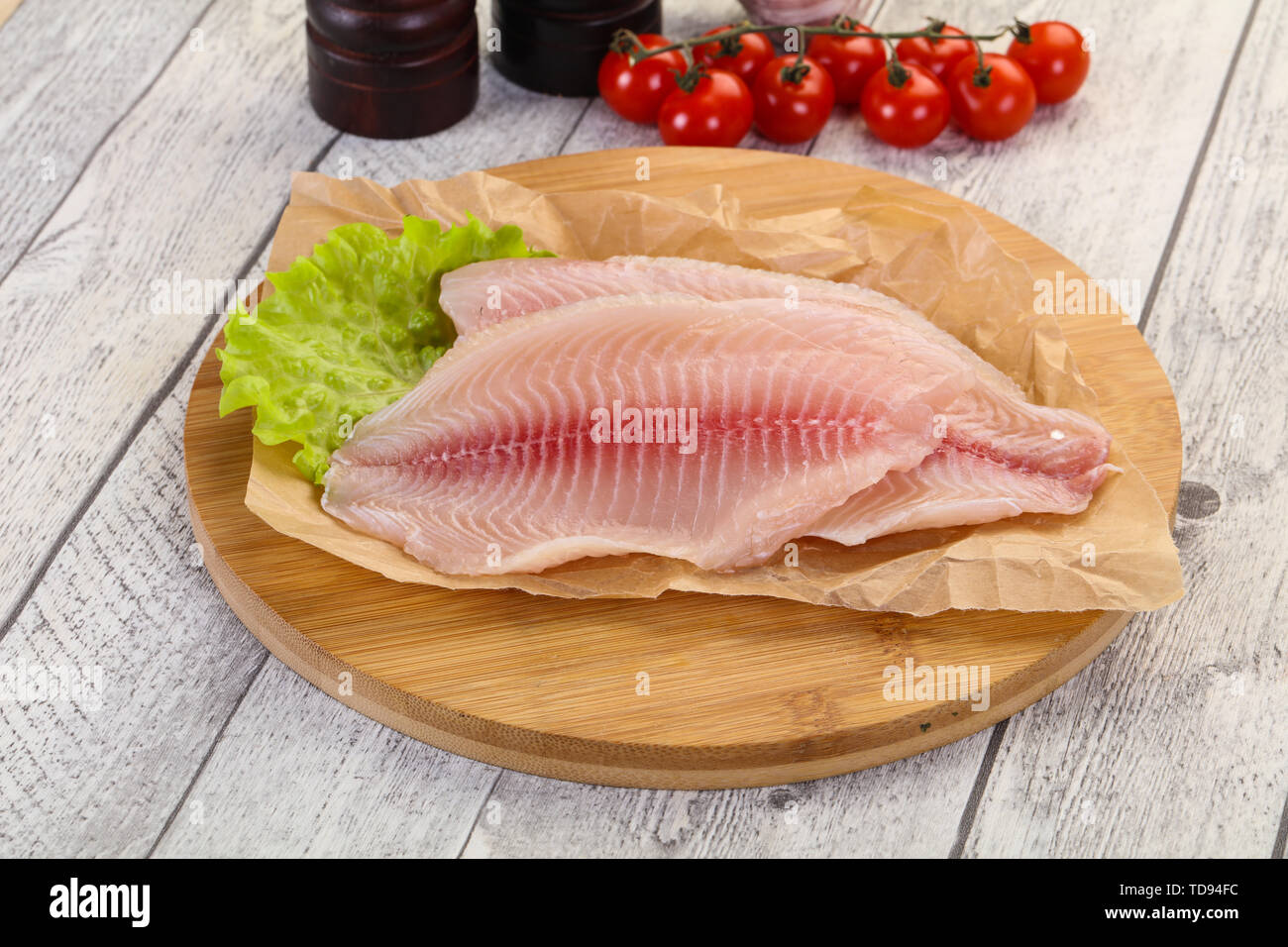 Raw tilapia fish ready for cooking Stock Photo - Alamy
