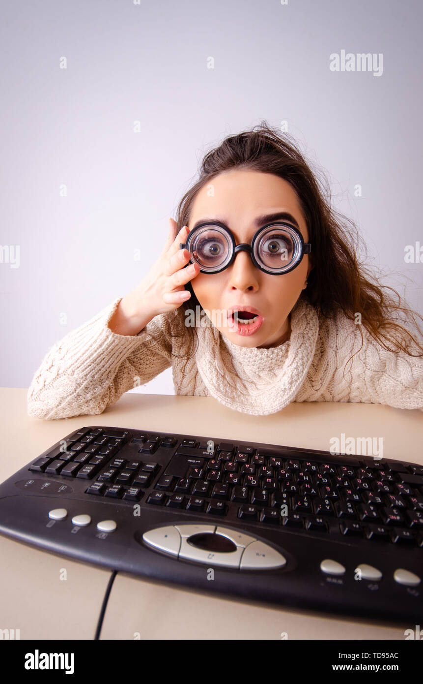 Funny nerd girl working on computer Stock Photo - Alamy