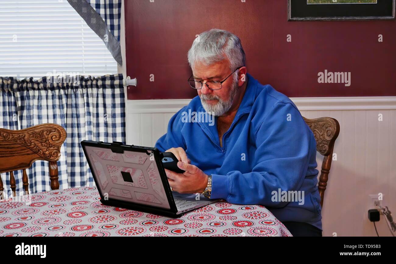 Senior Citizen Happy Texting on his Phone Stock Photo - Alamy