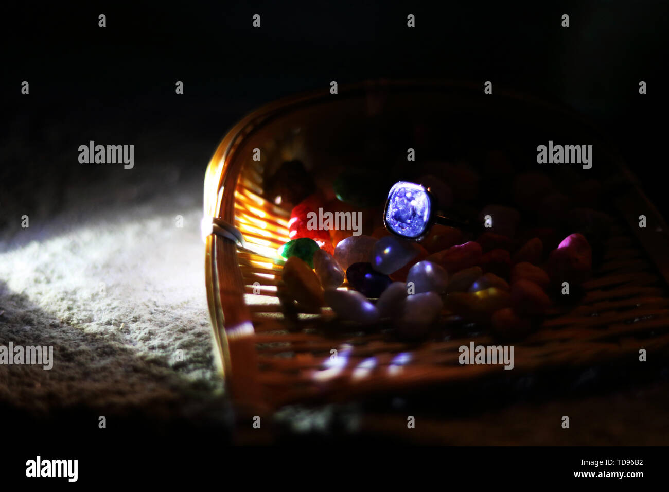 Ring on colored stone, diamond ring Stock Photo - Alamy
