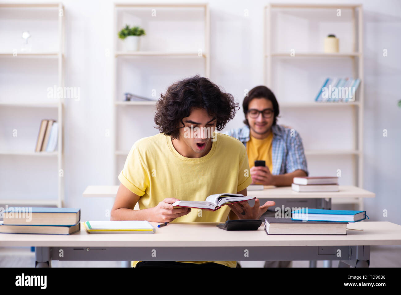 Two male students in the classroom Stock Photo - Alamy