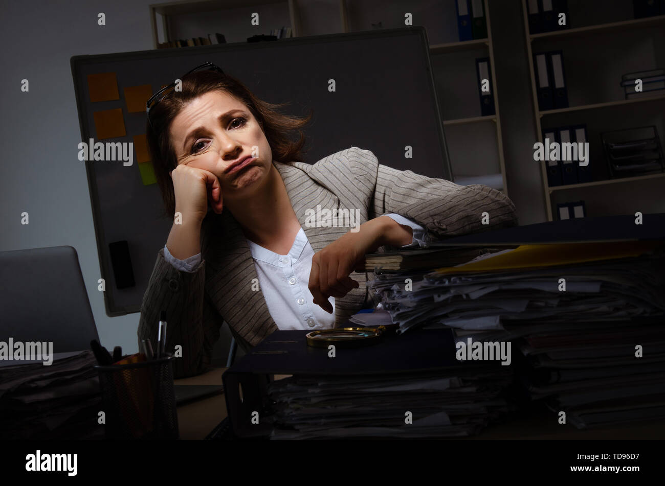 Female employee suffering from excessive work Stock Photo - Alamy