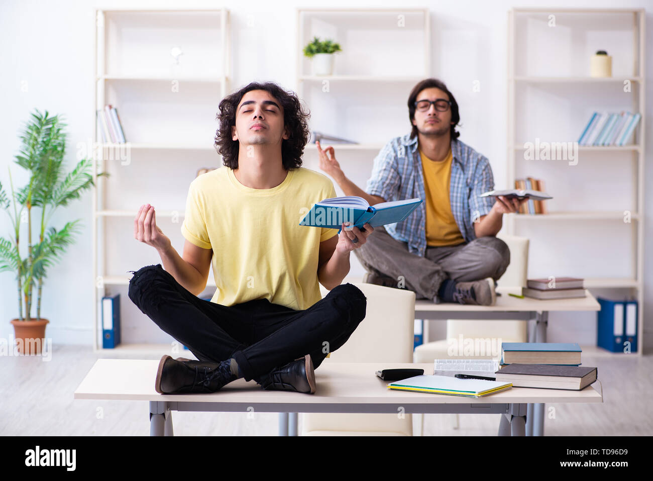 Two male students in the classroom Stock Photo - Alamy
