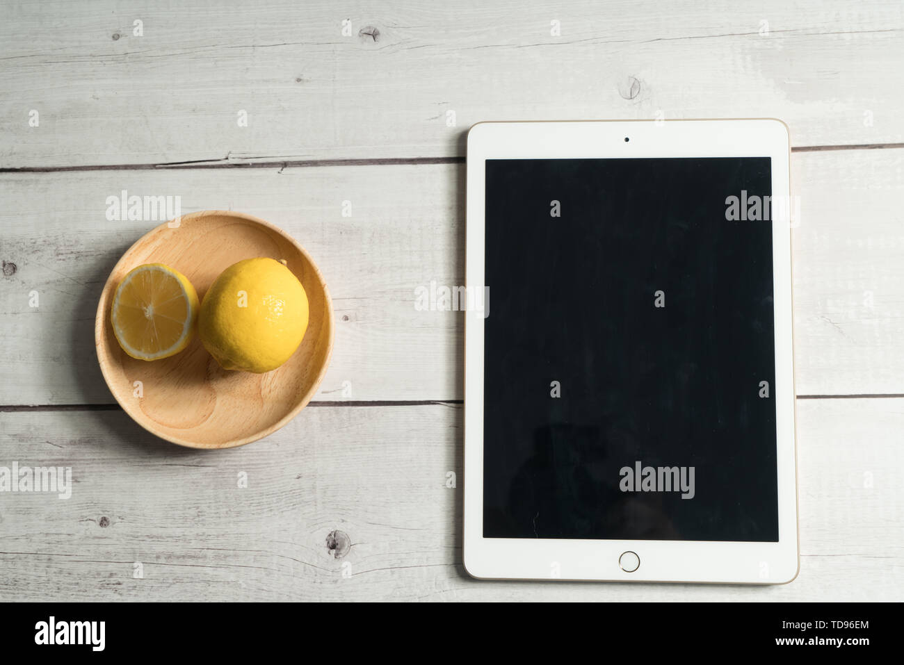Lemon with tablet Stock Photo - Alamy