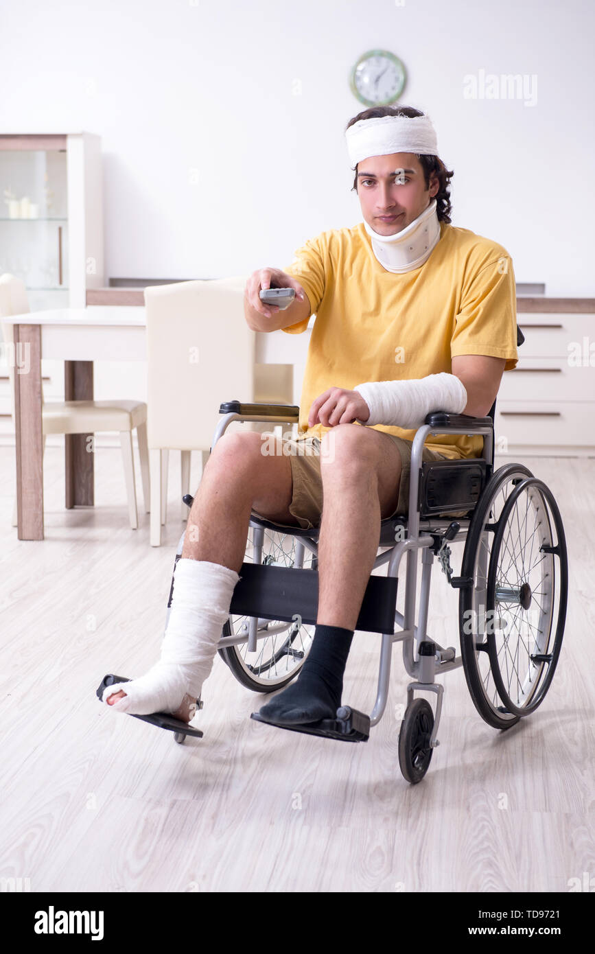 Young man after accident recovering at home Stock Photo - Alamy