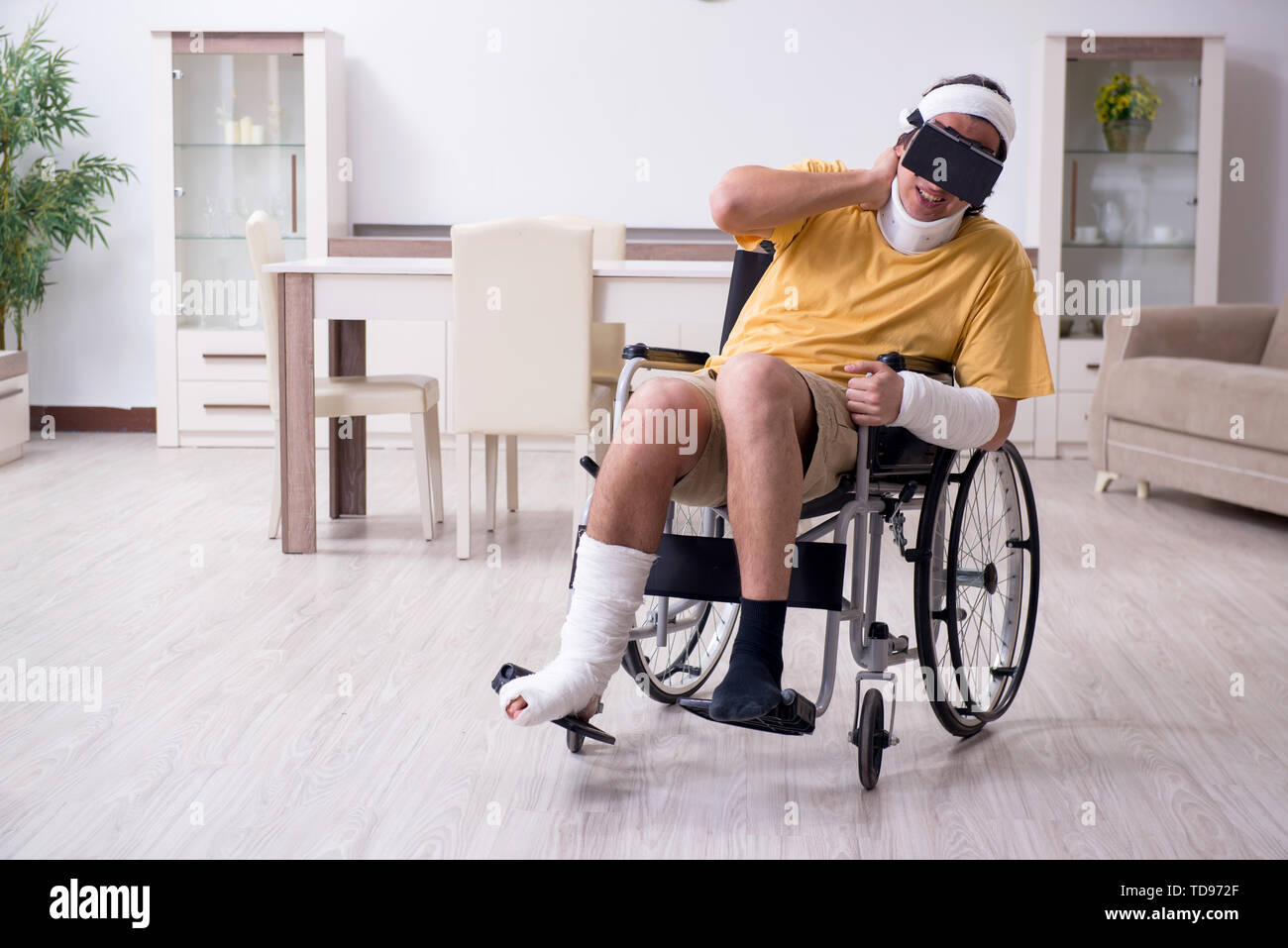 Young man after accident recovering at home Stock Photo - Alamy
