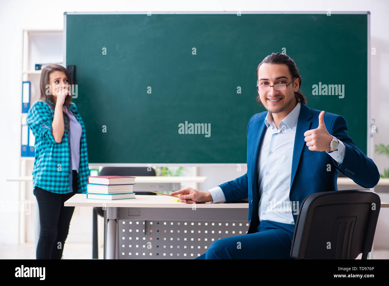Teen girl speaking up in class hi-res stock photography and images - Alamy