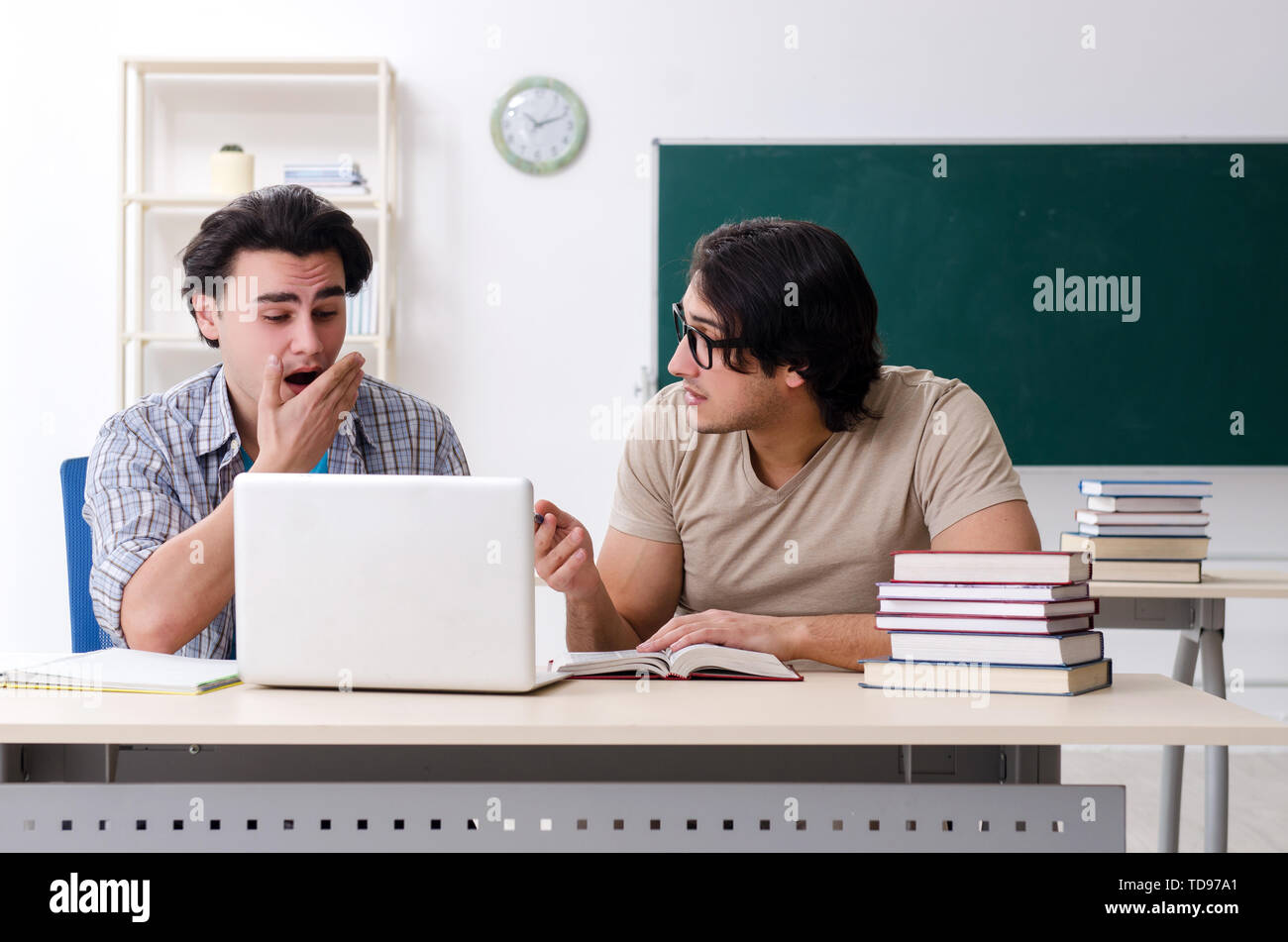 Two male students in the classroom Stock Photo - Alamy