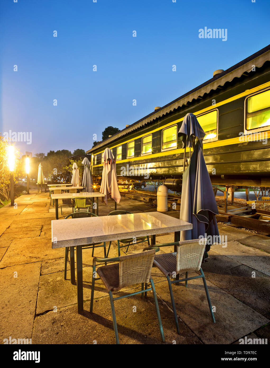 outdoor cafe bar with an old train background Stock Photo - Alamy