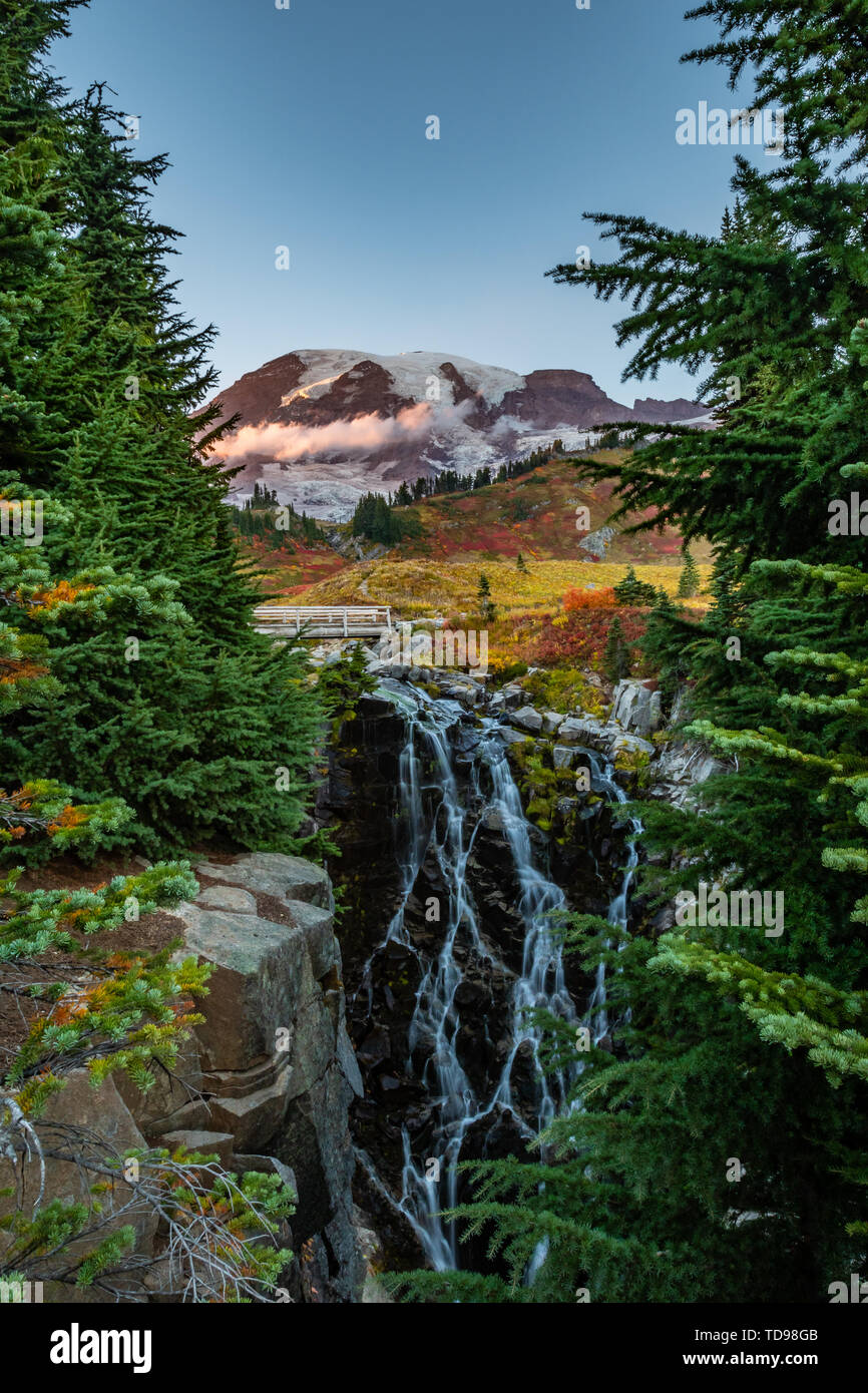 Mt Rainier and Myrtle Falls tumbling over cliff in fall Stock Photo - Alamy
