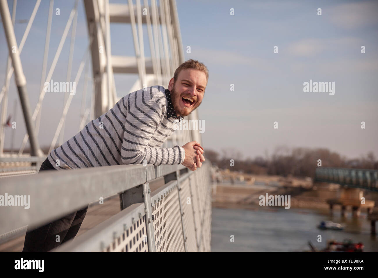Man leaning over fence hi-res stock photography and images - Alamy