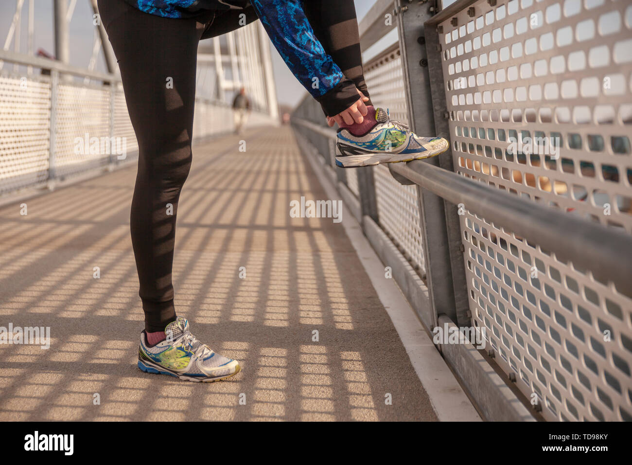 unrecognizable person, one young man, athlete wearing running shoes ...