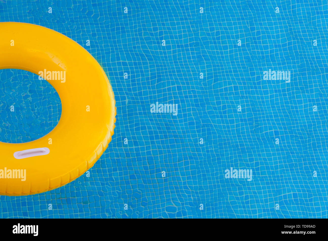 Colorful floats on a pool of crystal clear water Stock Photo - Alamy