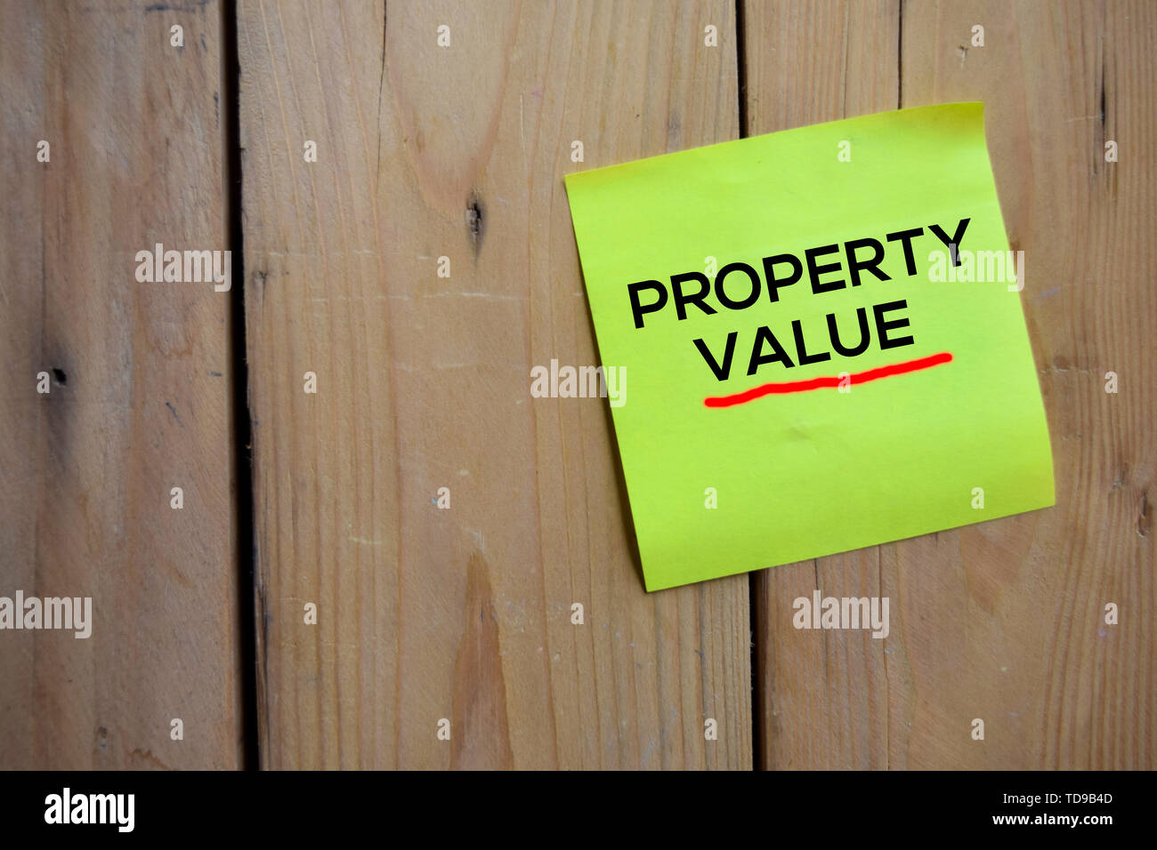 Property Value text on sticky notes with wooden background Stock Photo ...