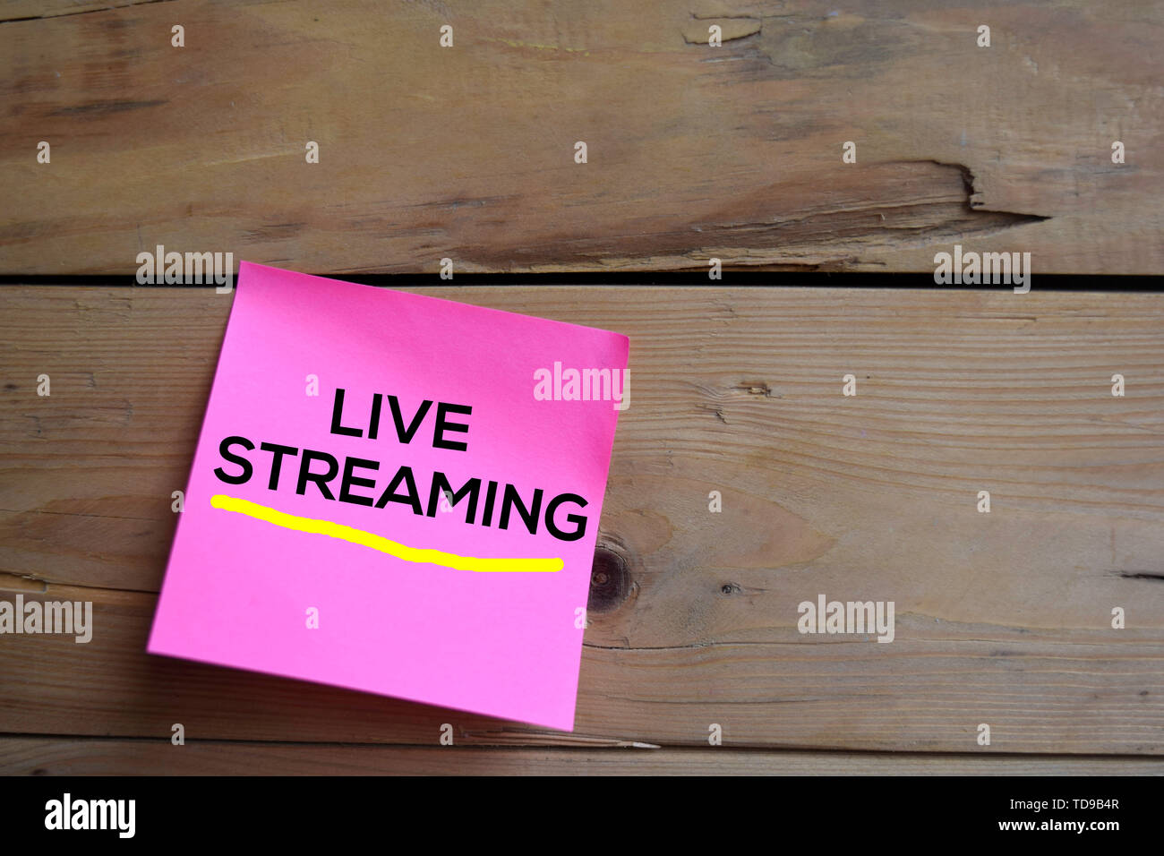 Live Streaming text on sticky notes with wooden background Stock Photo ...