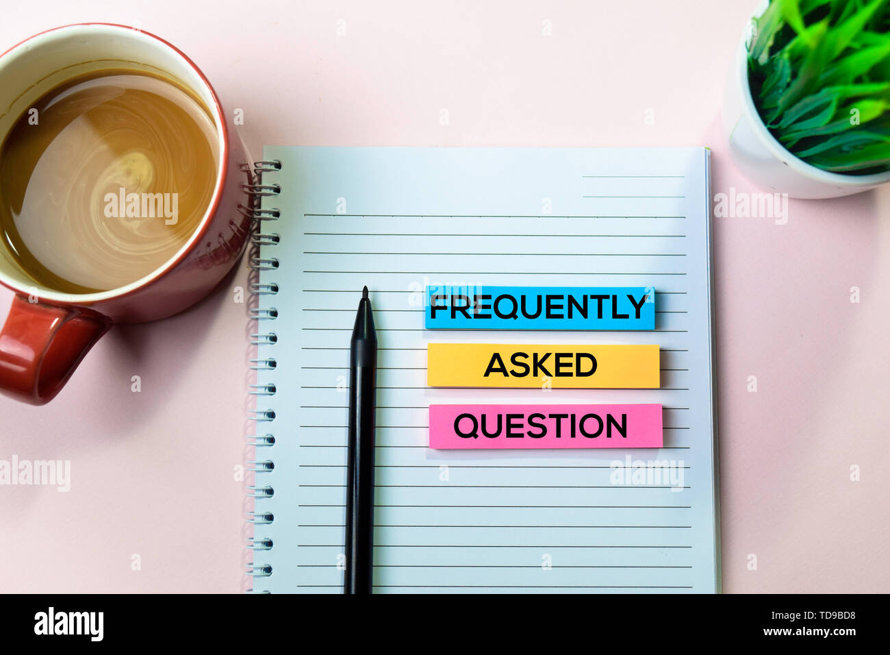 Frequently Asked Question (FAQ) text on sticky notes with office desk ...