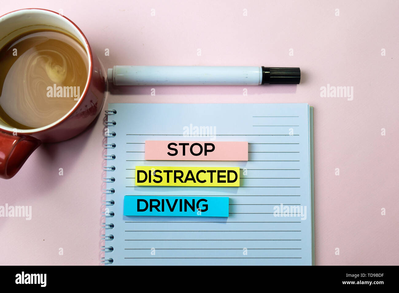 Stop Distracted Driving text on sticky notes with office desk concept ...