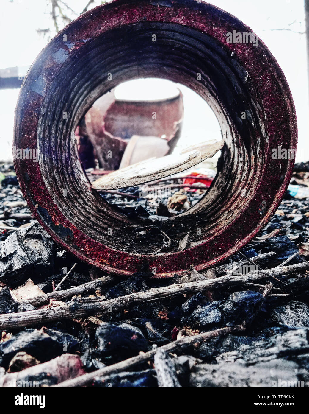Burned and corroded insecticidal cans Stock Photo - Alamy