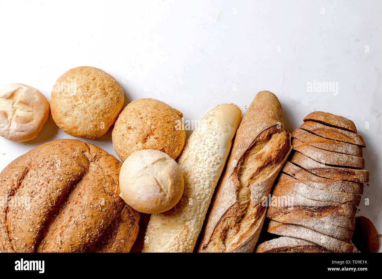 assortment of different types of bread, loaf, baguettes, loaves, rolls ...