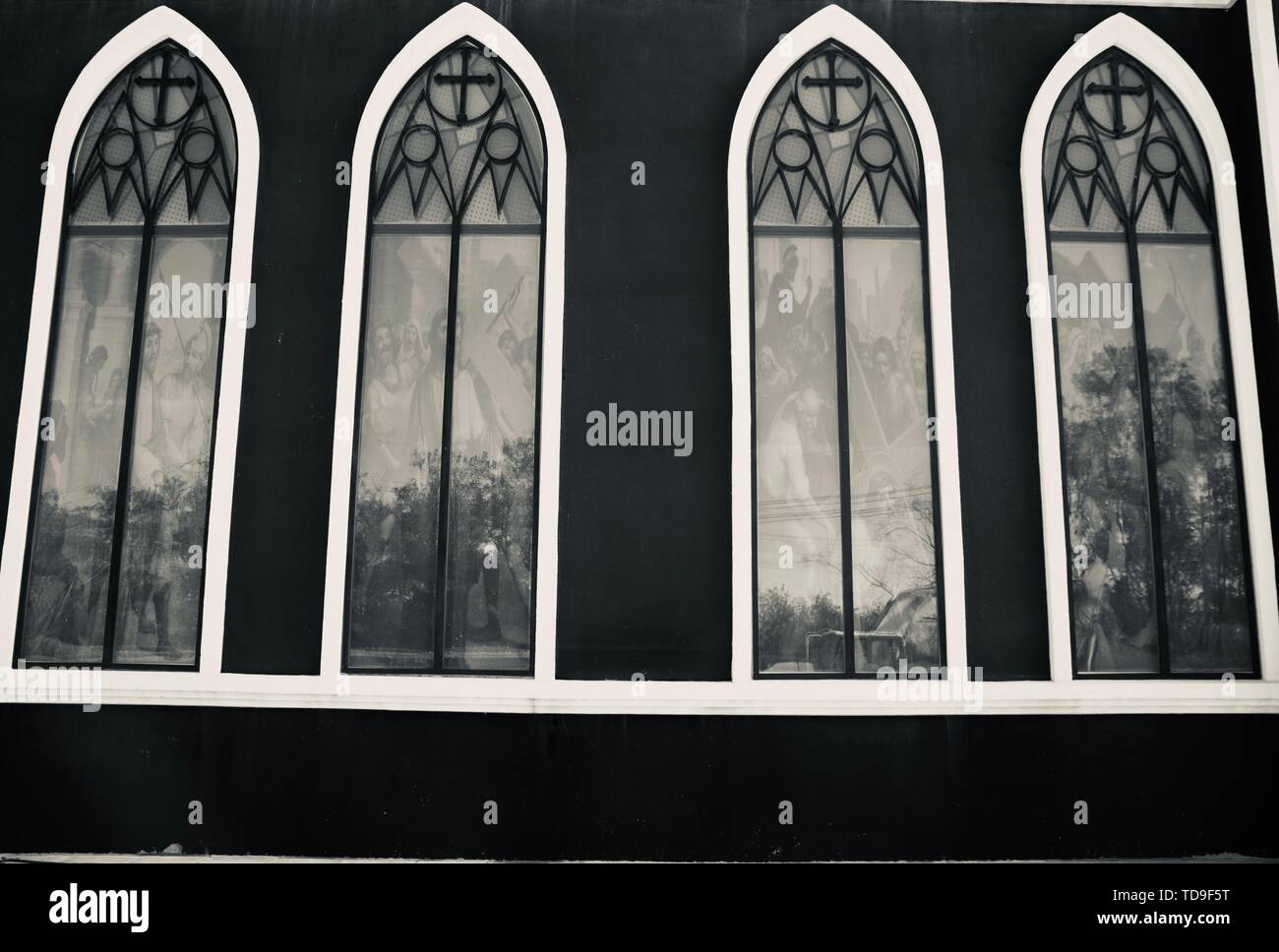 4 windows outside the church, very symmetrical design Stock Photo - Alamy