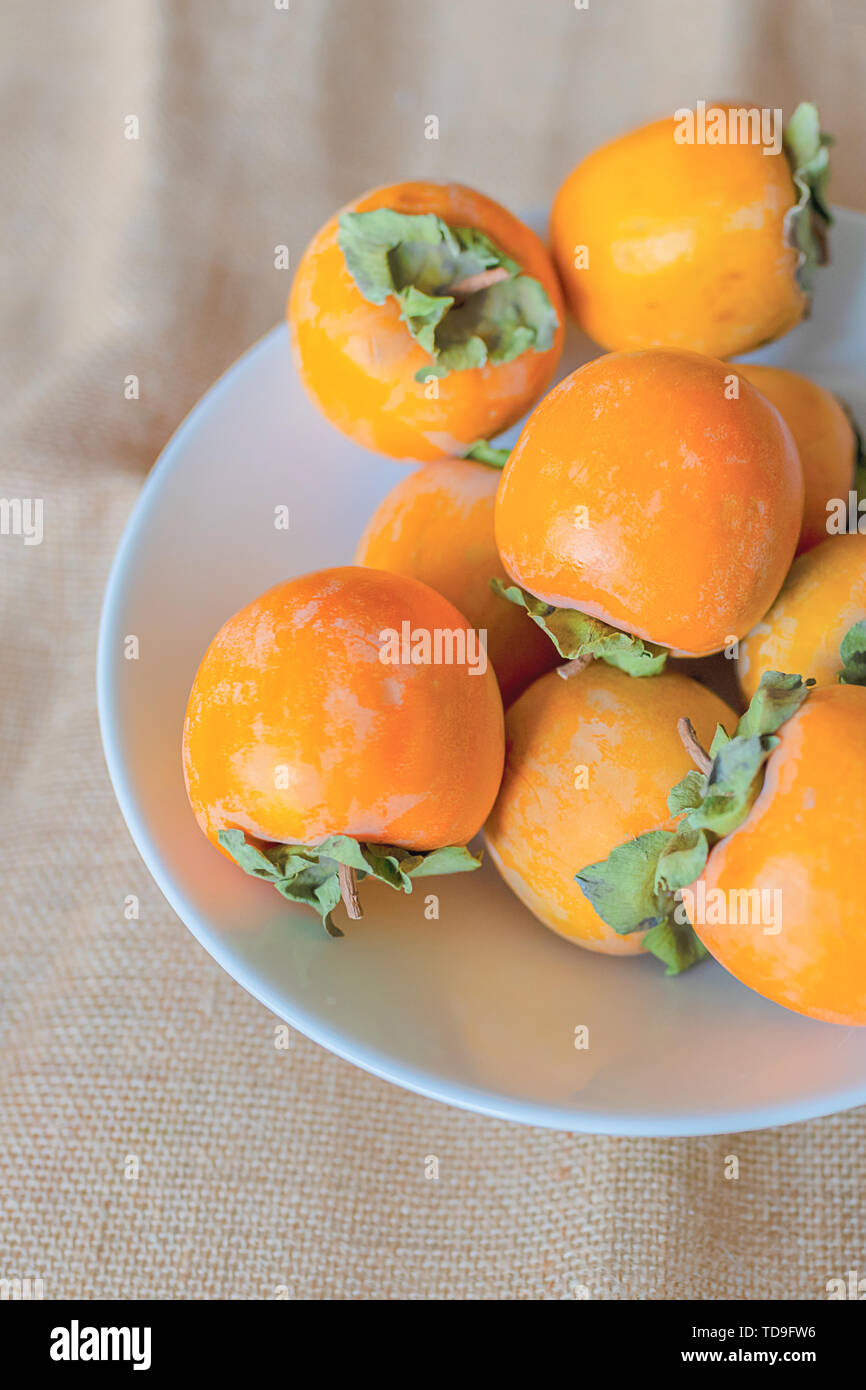 Crispy sweet persimmon Stock Photo - Alamy
