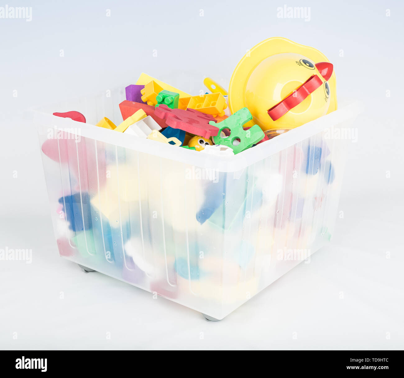 Plastic container with toys for kids Stock Photo - Alamy