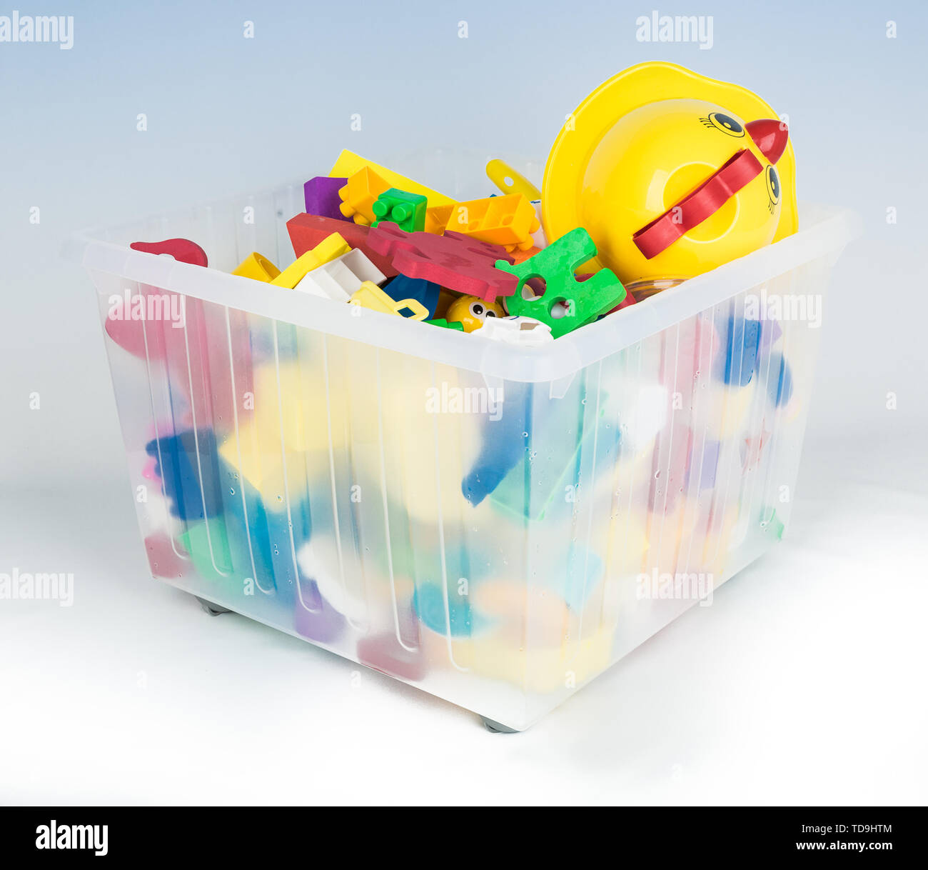 Plastic container with toys for kids Stock Photo - Alamy