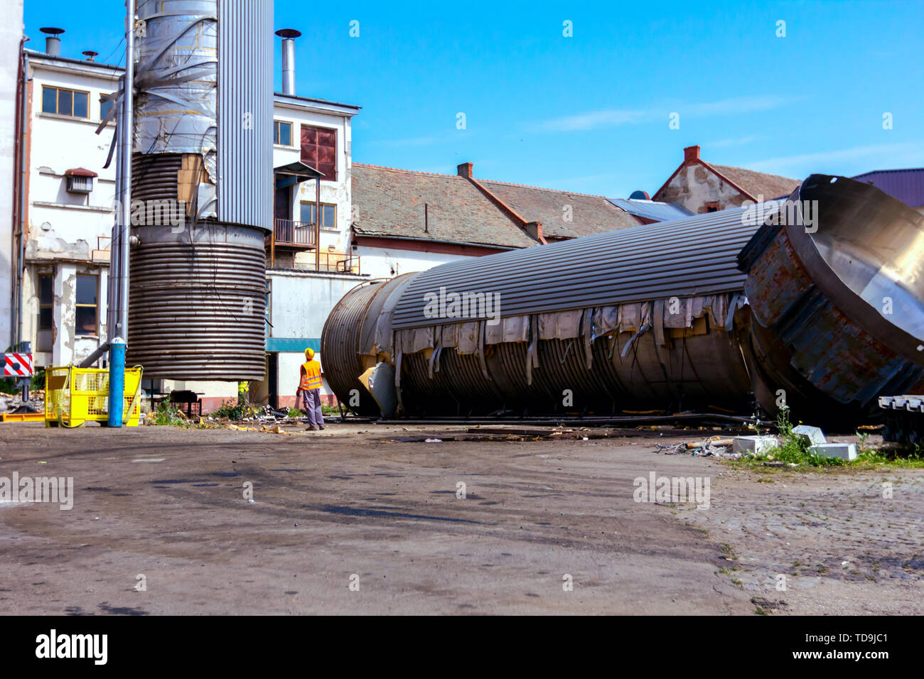 Worker is helping crane to manage huge construction. They are bringing ...