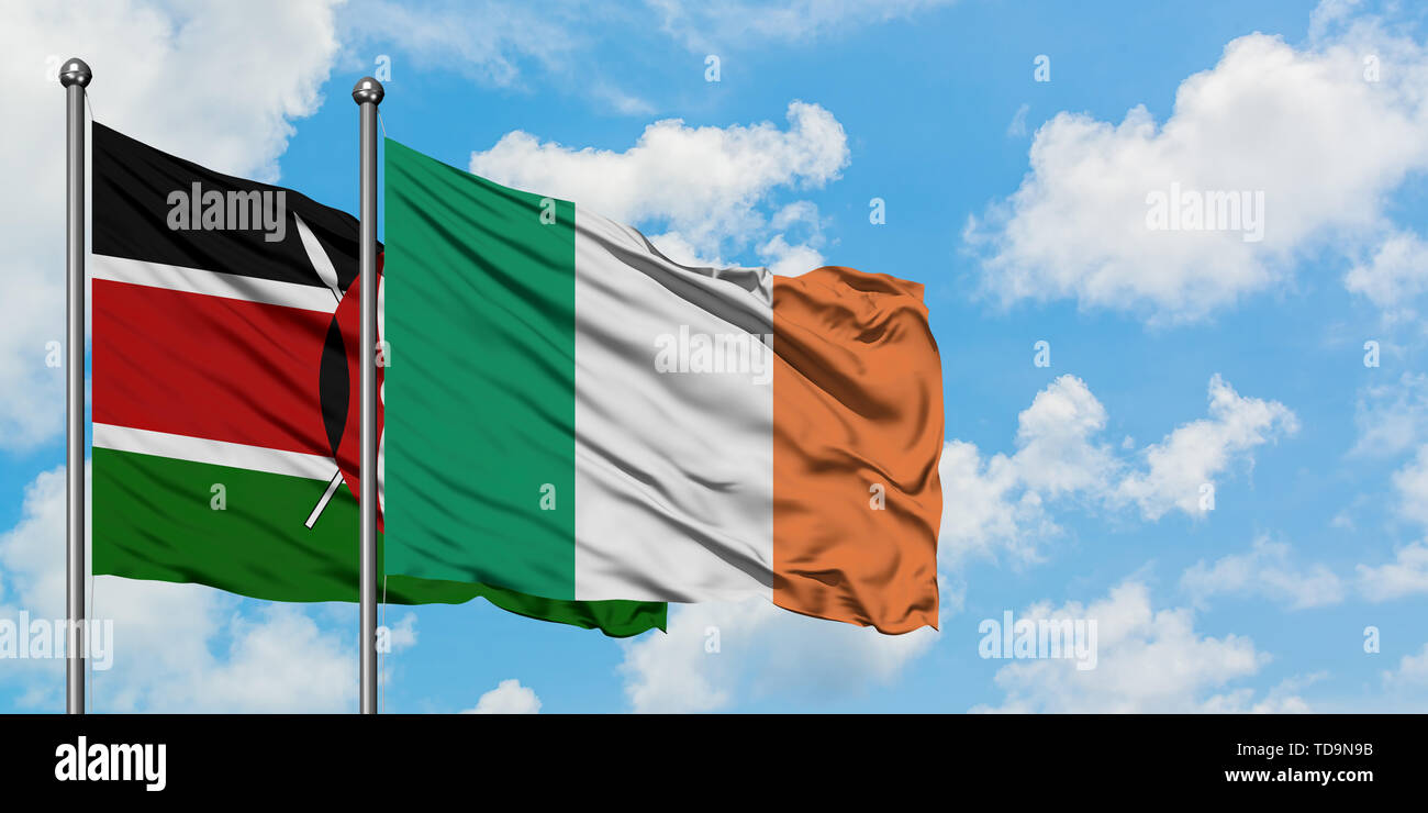 Kenya and Ireland flag waving in the wind against white cloudy blue sky ...