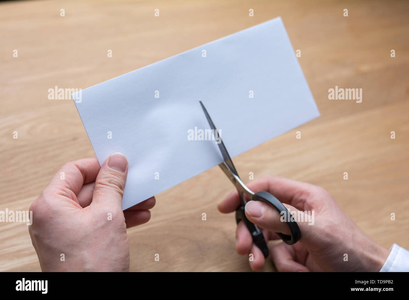 Topping cutting paper by scissors Stock Photo - Alamy