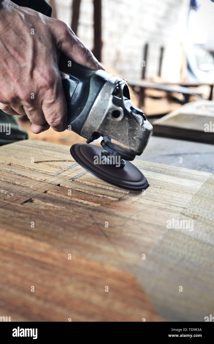 Wood worker carving wood Stock Photo - Alamy
