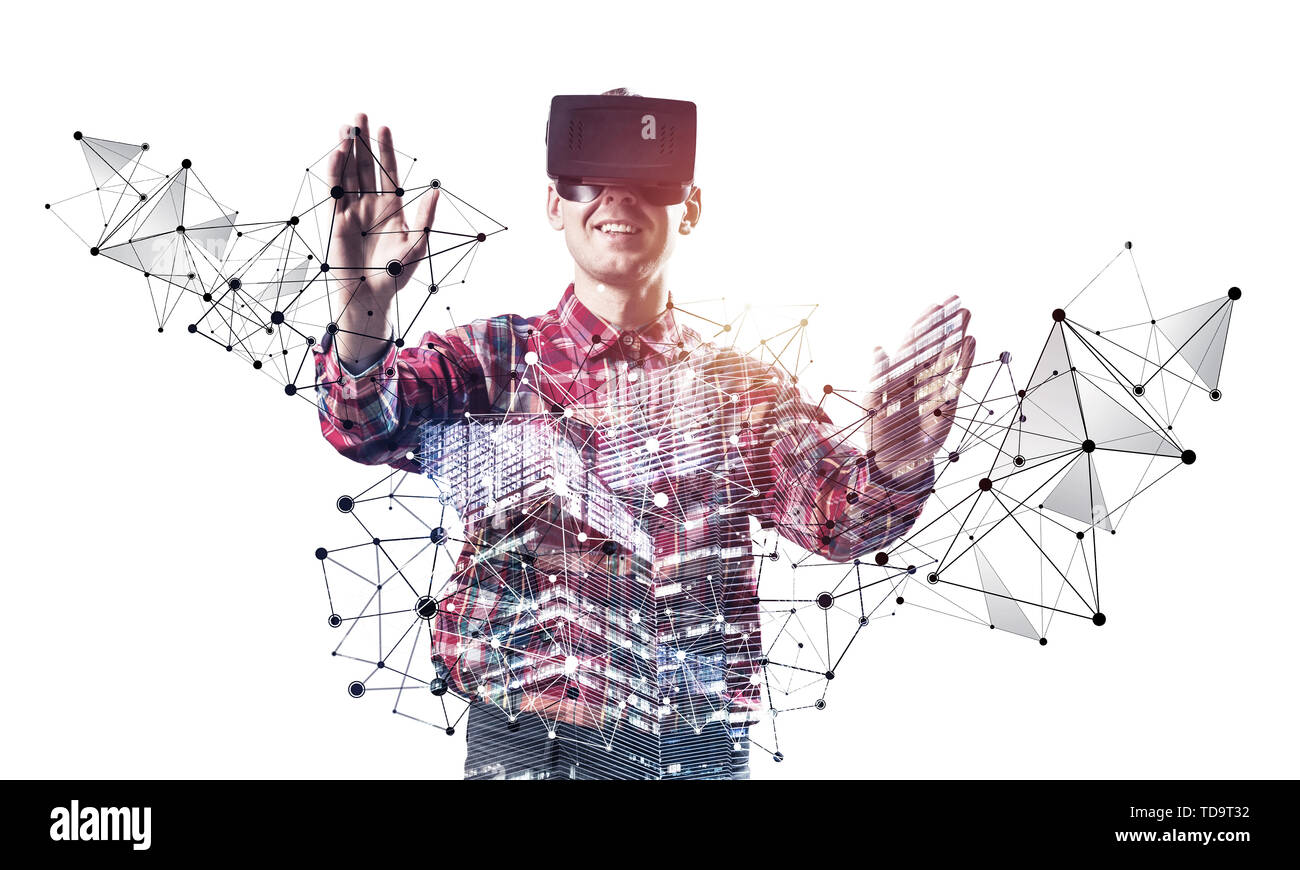 Young programmer wearing VR headset working with virtual model. New ...