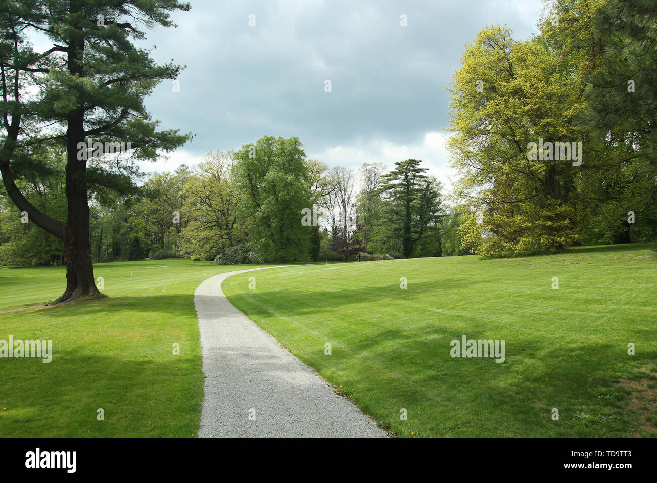 Stone pathway in a garden park, spring season Stock Photo - Alamy