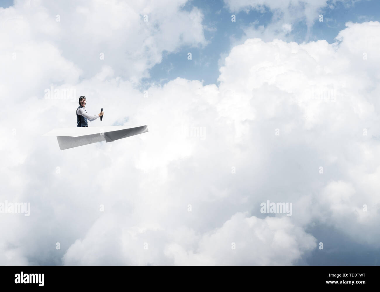 Aviator having fun in aircraft. Pilot in leather helmet and goggles ...